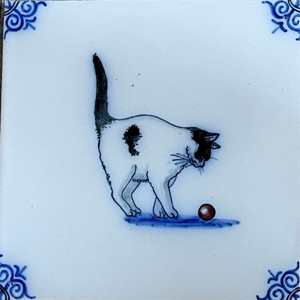 Custom Dutch tiles with hand-painted scenes of cats